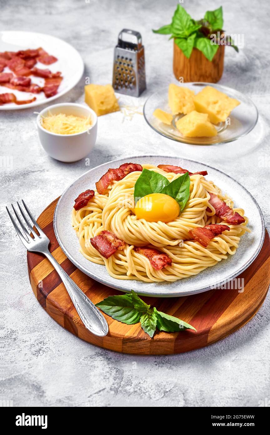 Traditional Italian Pasta Carbonara with bacon, cheese and egg yolk on ...