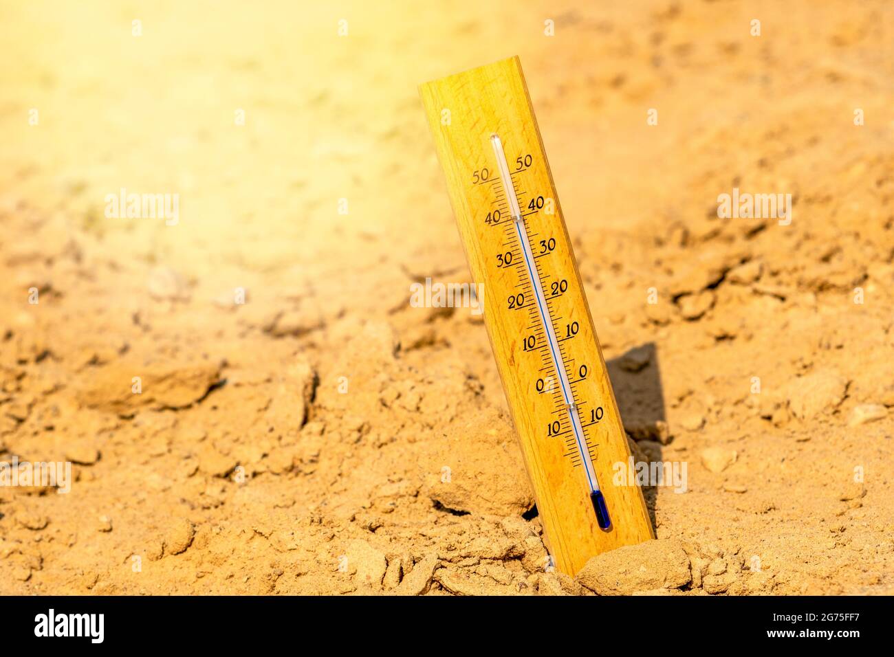 Thermometer shows very hot summer temperature in dry desert sand dunes ...
