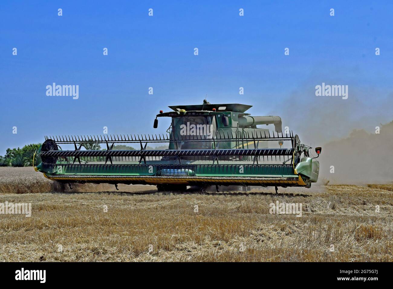 An S770 John Deere combine with a 735FD cutter header attached in the ...