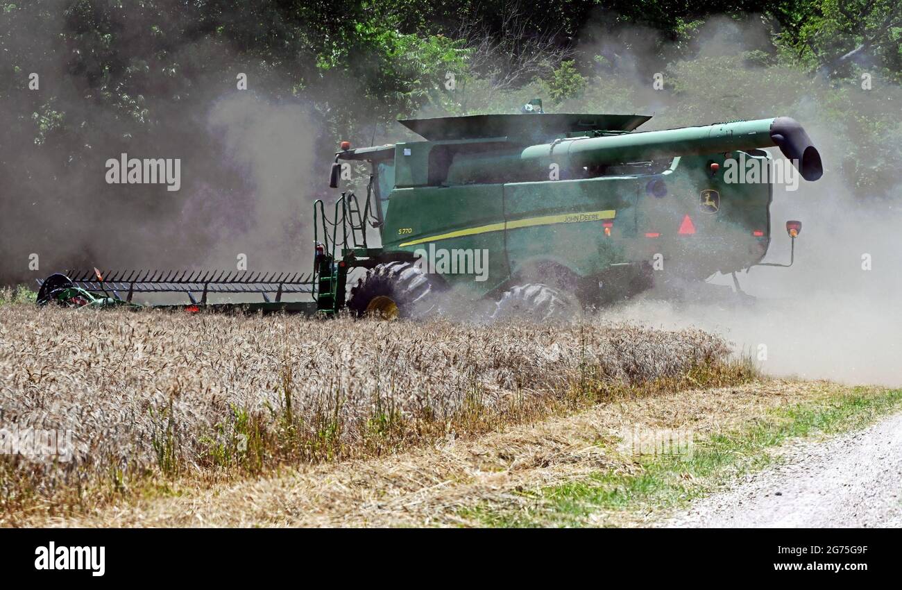 An S770 John Deere combine with a 735FD cutter header attached in the ...