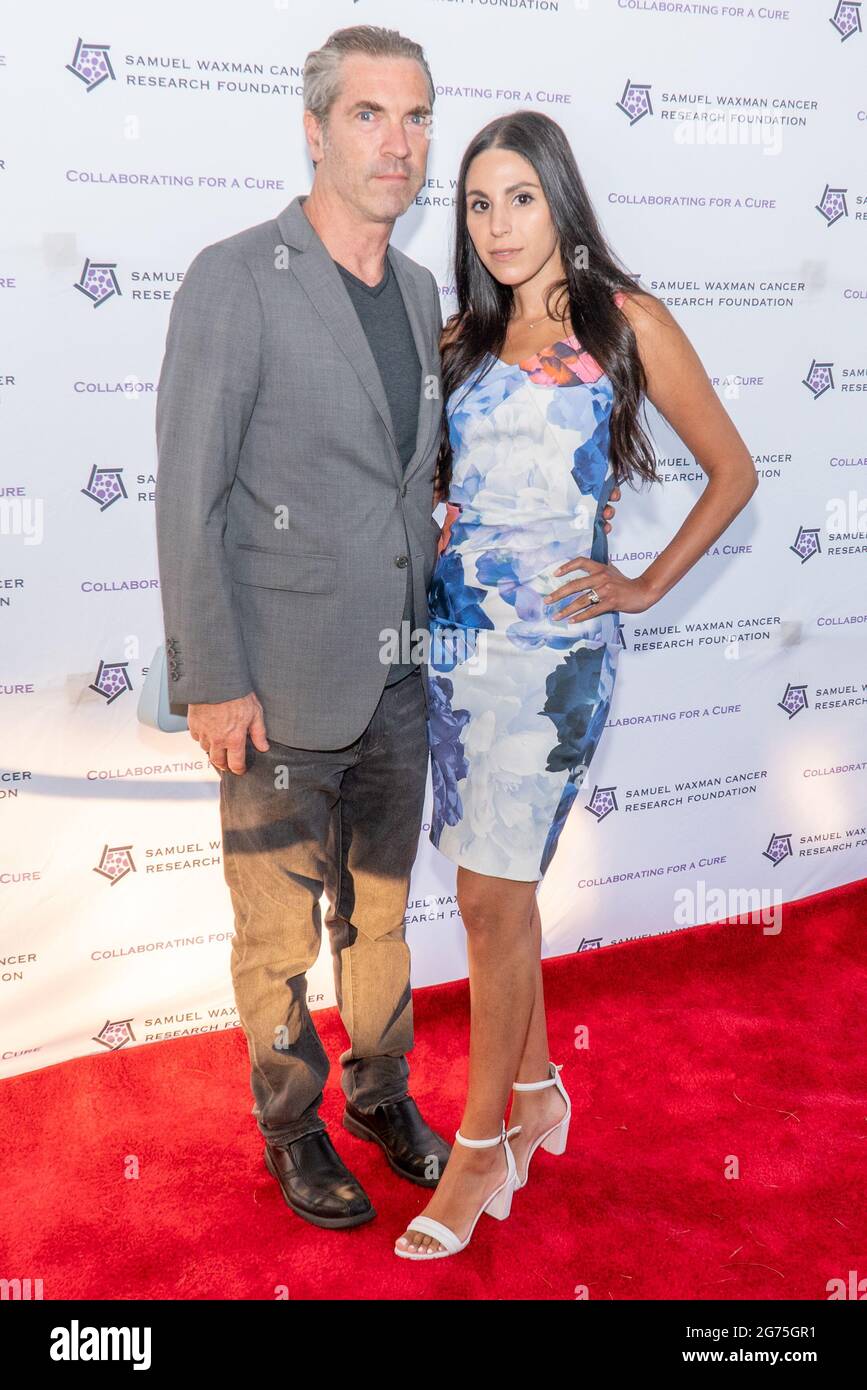 Justin Mitchell and Alison Mitchell attend the Samuel Waxman Cancer ...