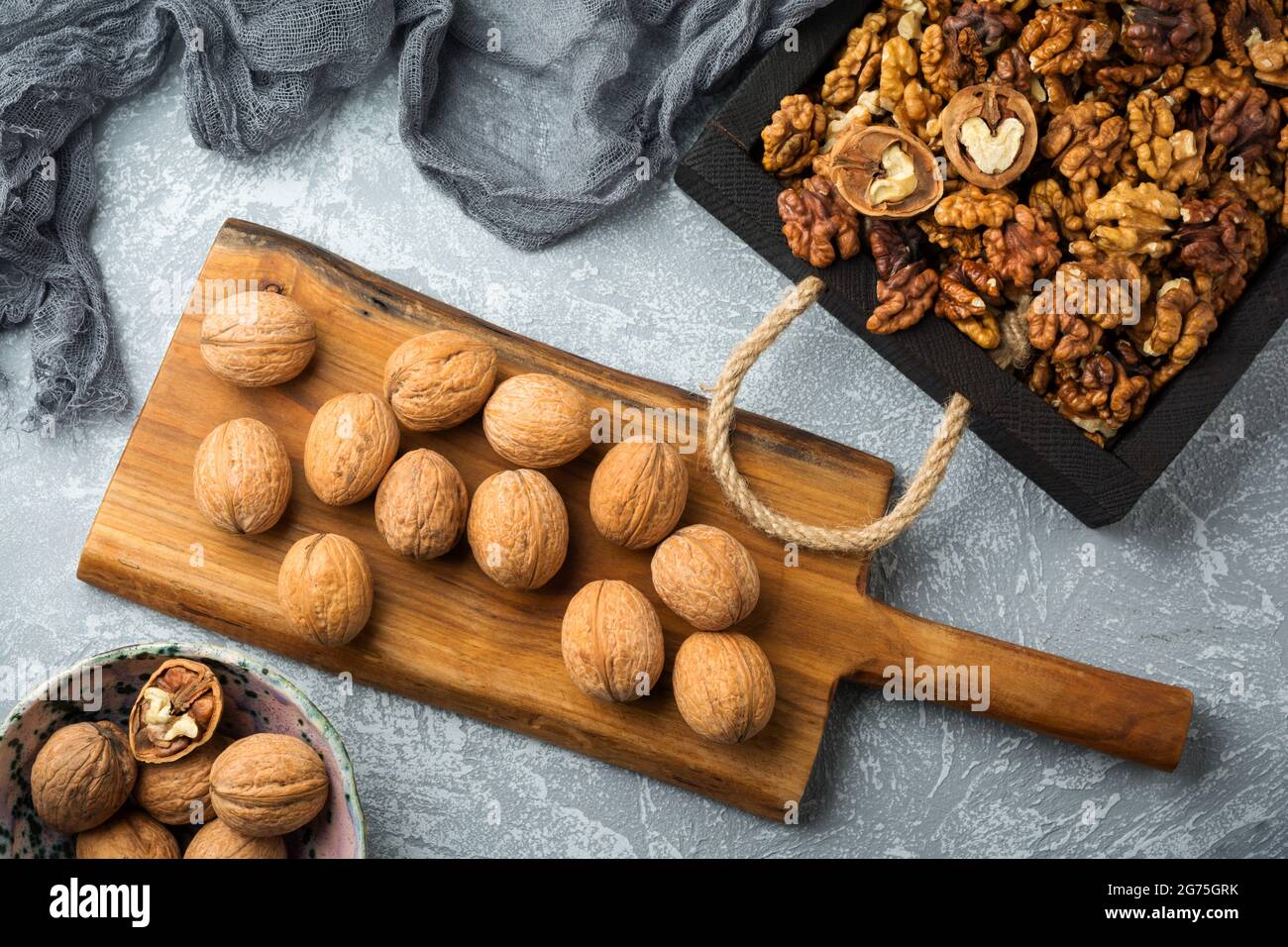 Mature dried walnuts in a wooden box, tasty healthy walnuts. Top view ...