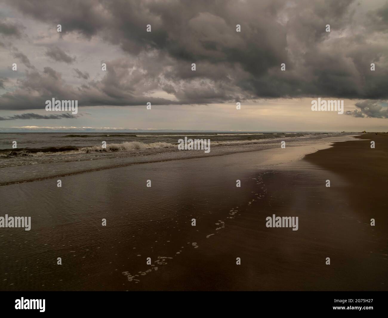 Down by the Seaside Cold cloudy day foam on the sea clouds and ...