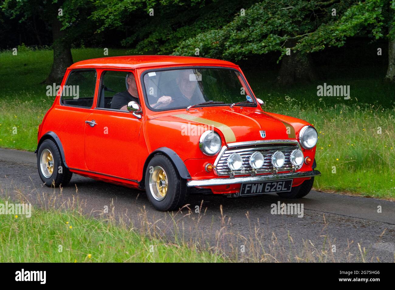 A front view of 1972 70s nineties orange Morris Mini 848cc petrol small ...