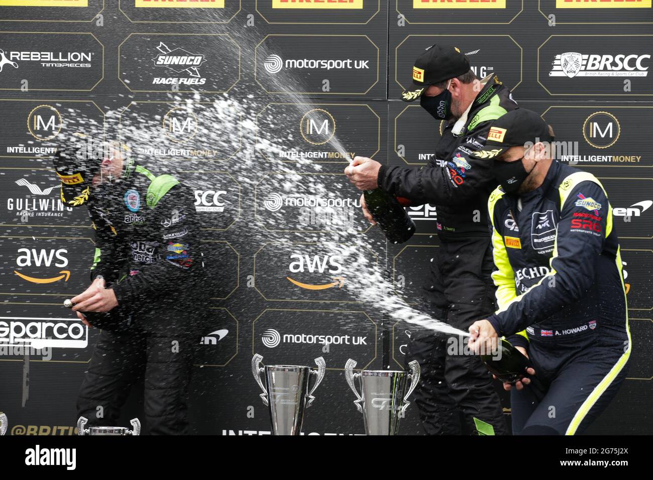 Castle Donington, UK. 11th July, 2021. Race winner Sam Neary is sprayed ...