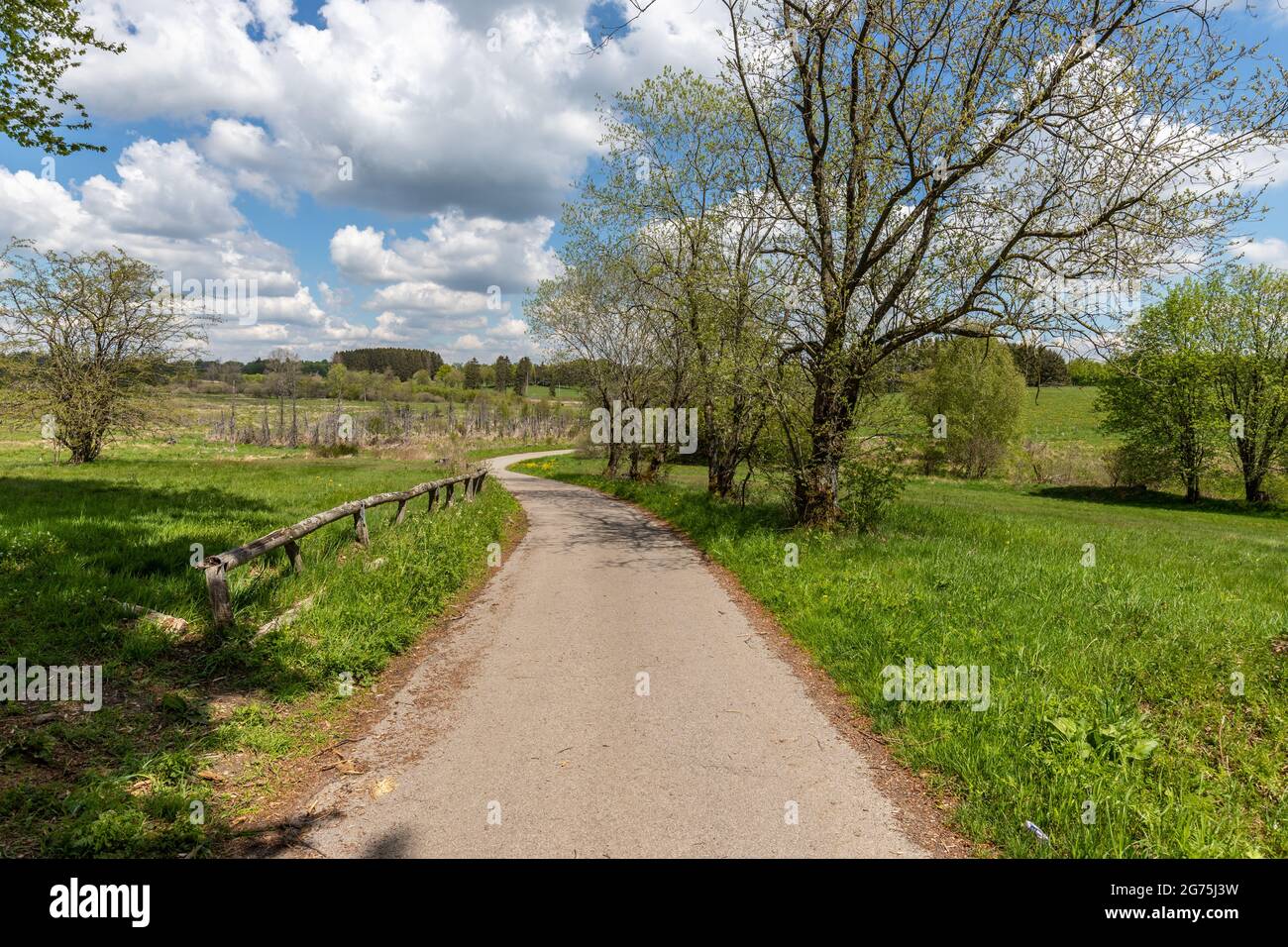 A hiking trail in a park in the Eifel region near Simmerath, Germany ...