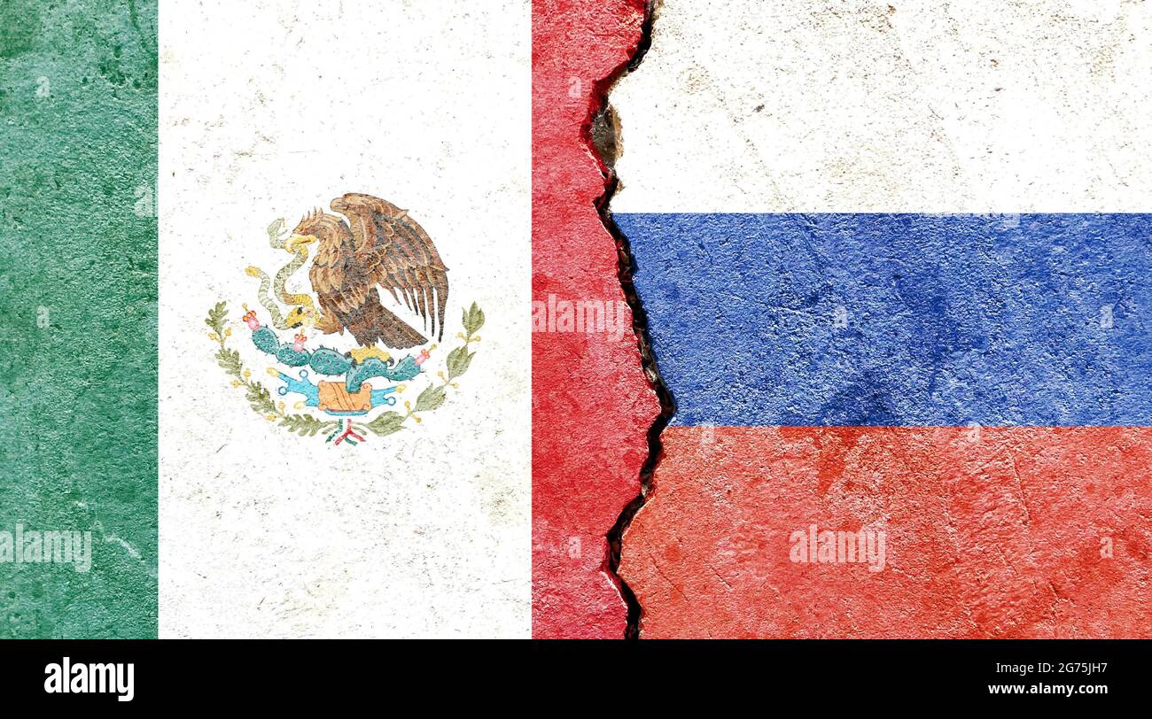 The flags of Mexico and Russia painted on a weathered broken wall ...