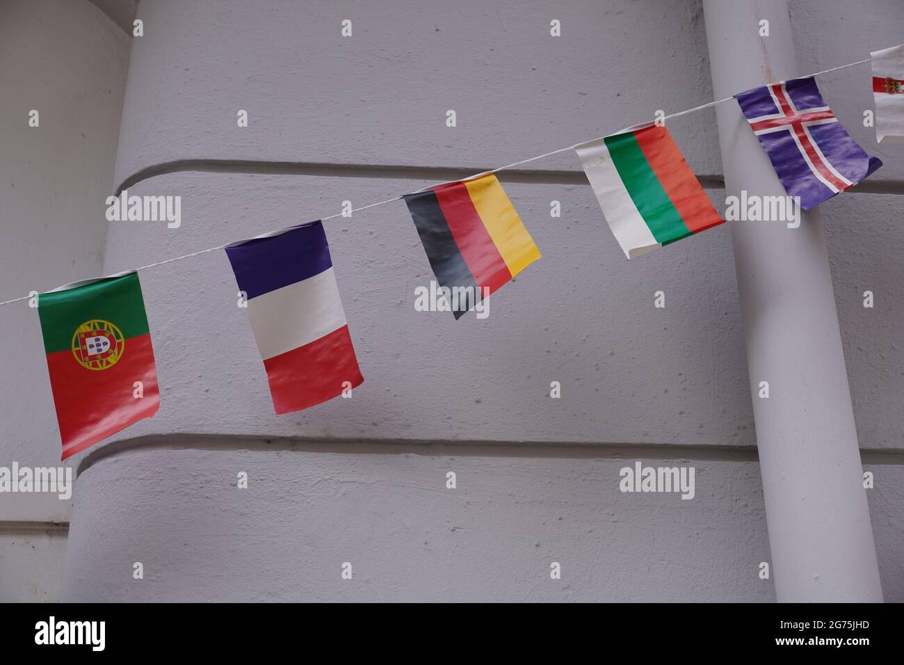 The international flags hanging on a rope Stock Photo - Alamy