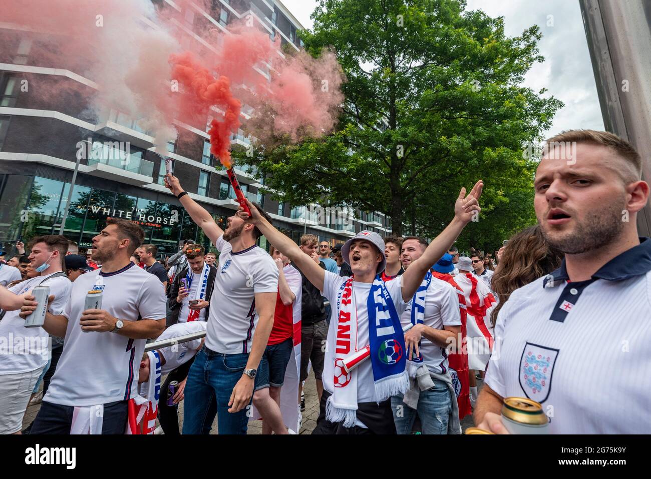 London, UK. 11 July 2021. England fans light flares outside Wembley ...