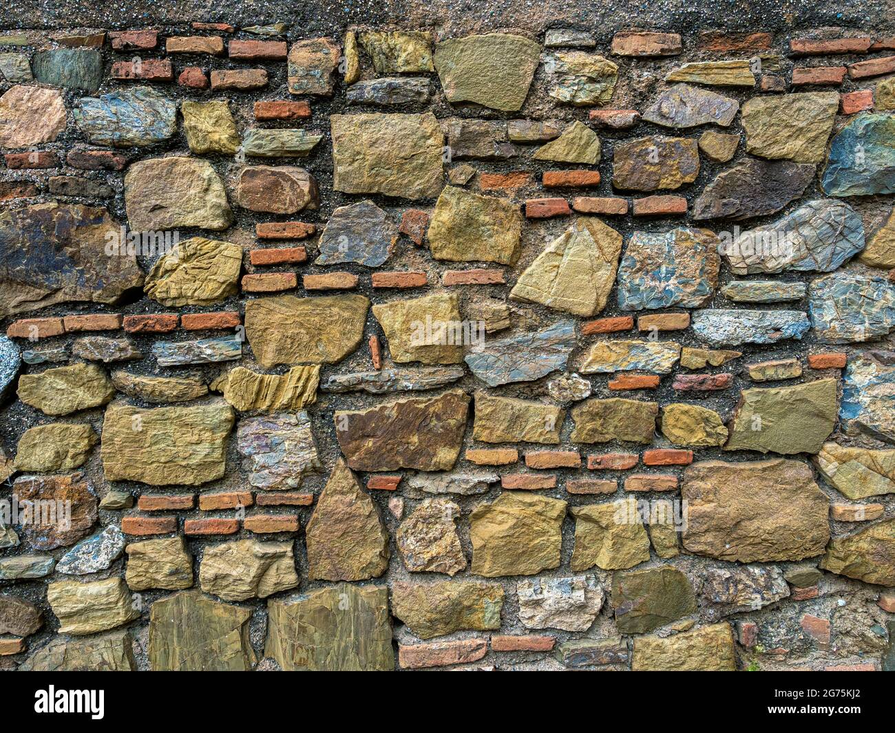 Old masonry texture, old brick wall made of different bricks and colors ...