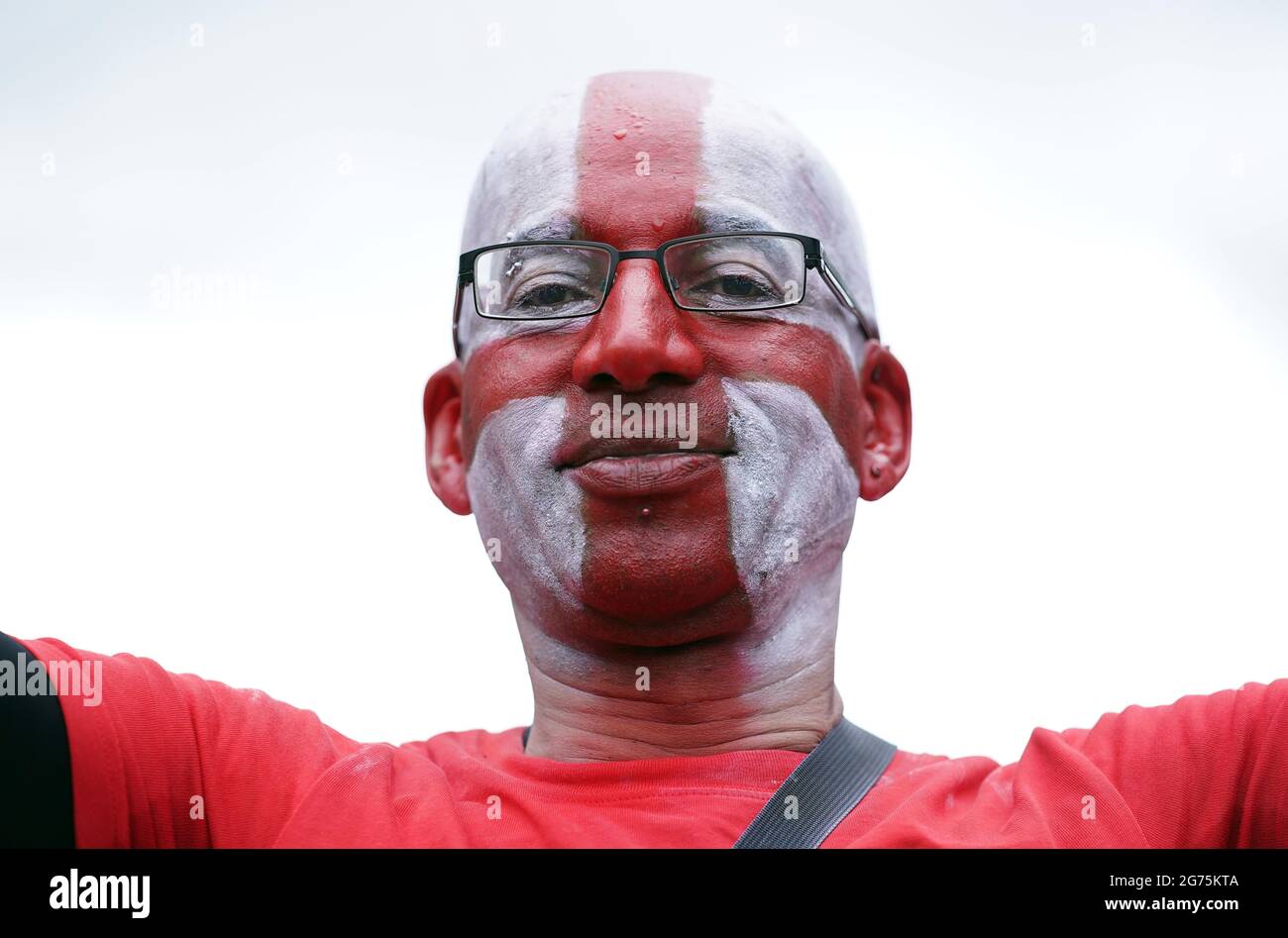 Face painted England fans outside the ground ahead of the UEFA Euro ...