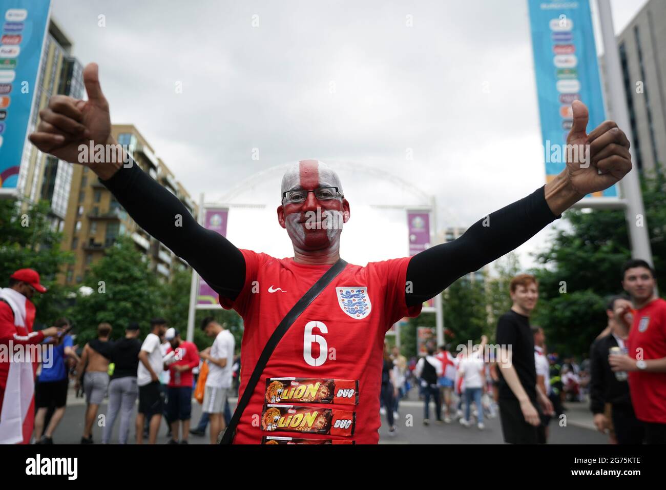 Face painted England fans outside the ground ahead of the UEFA Euro ...