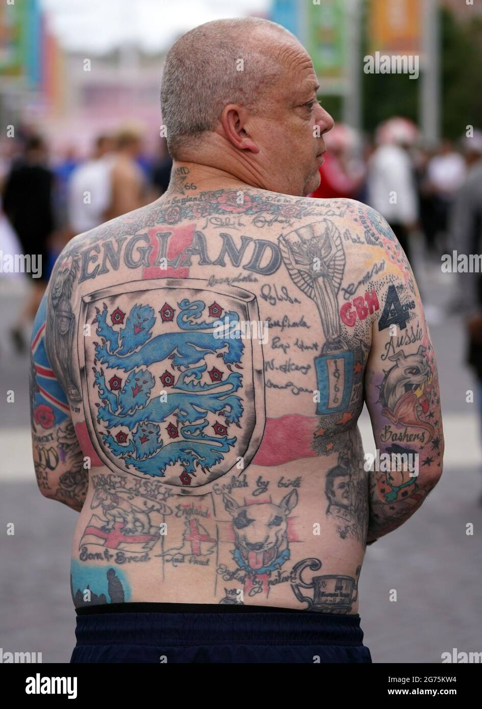 An England fan shows off his tattoos outside the ground ahead of the ...