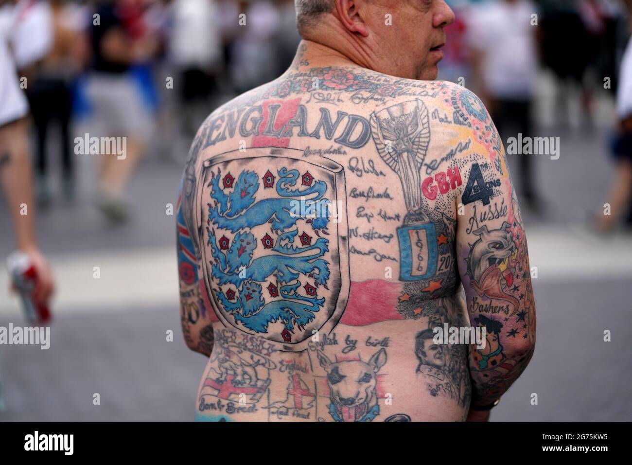 An England fan shows off his tattoos outside the ground ahead of the ...