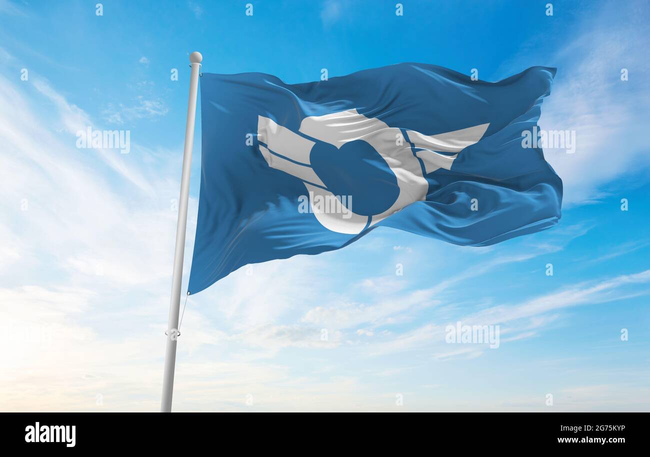 official flag of Shiga prefecture waving in the wind on flagpoles ...