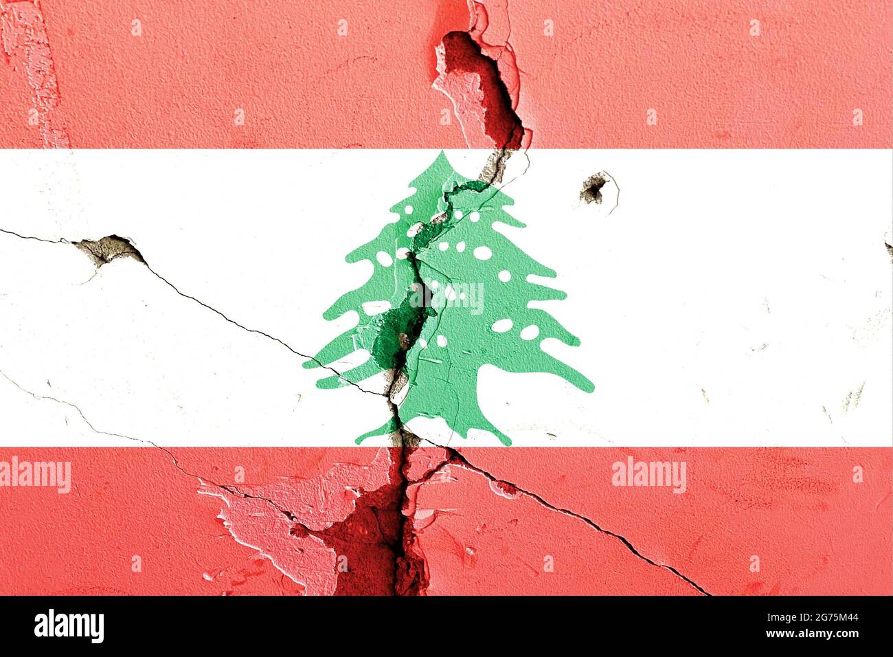 The national flag of Lebanon painted on a weathered broken wall ...
