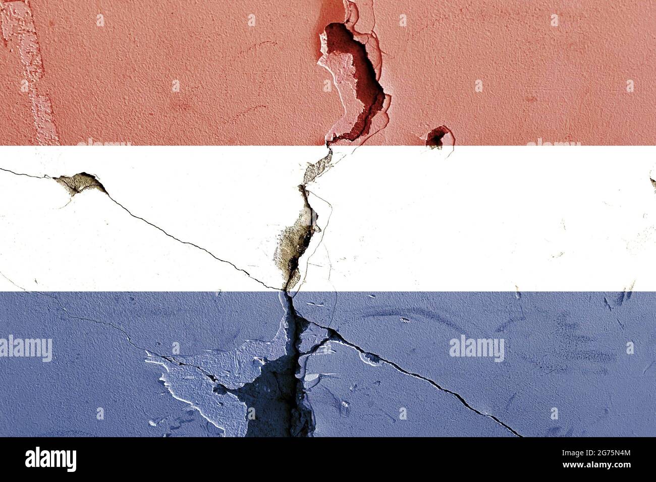 The national flag of Netherlands painted on a weathered broken wall ...