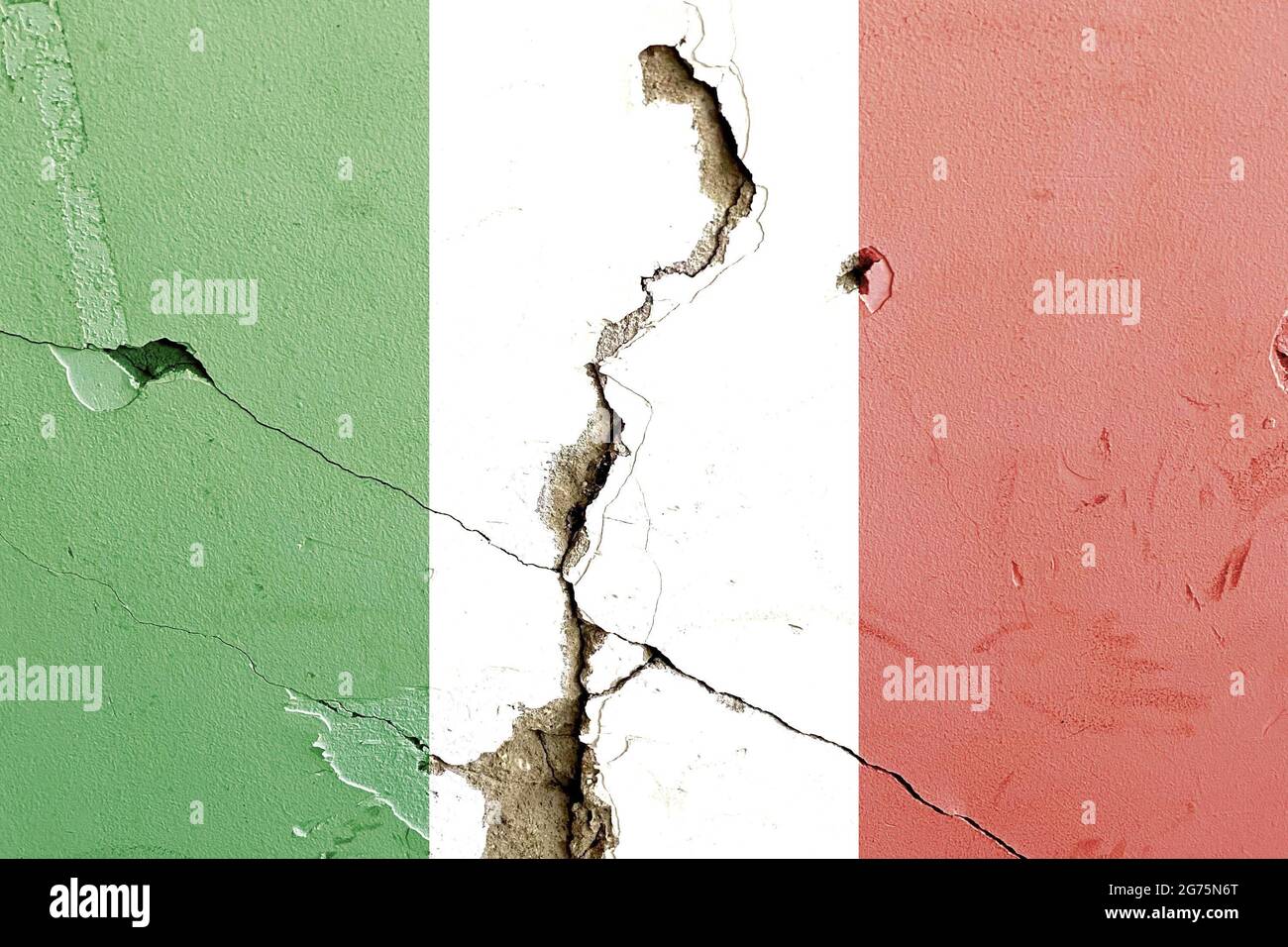 The national flag of Italy painted on a weathered broken wall ...
