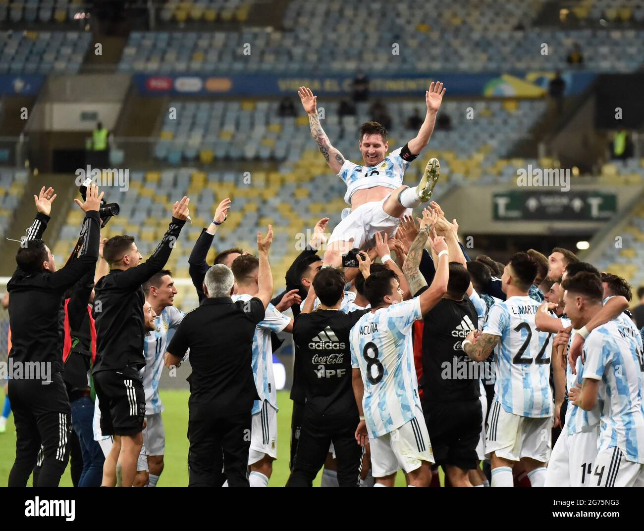 Teammates lift Argentina's Lionel Messi after beating Brazil 1-0 during ...