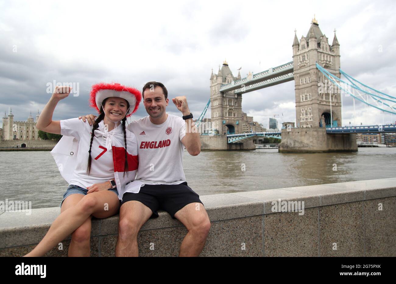England fans pose for a photograph in front of Tower Bridge in London ...