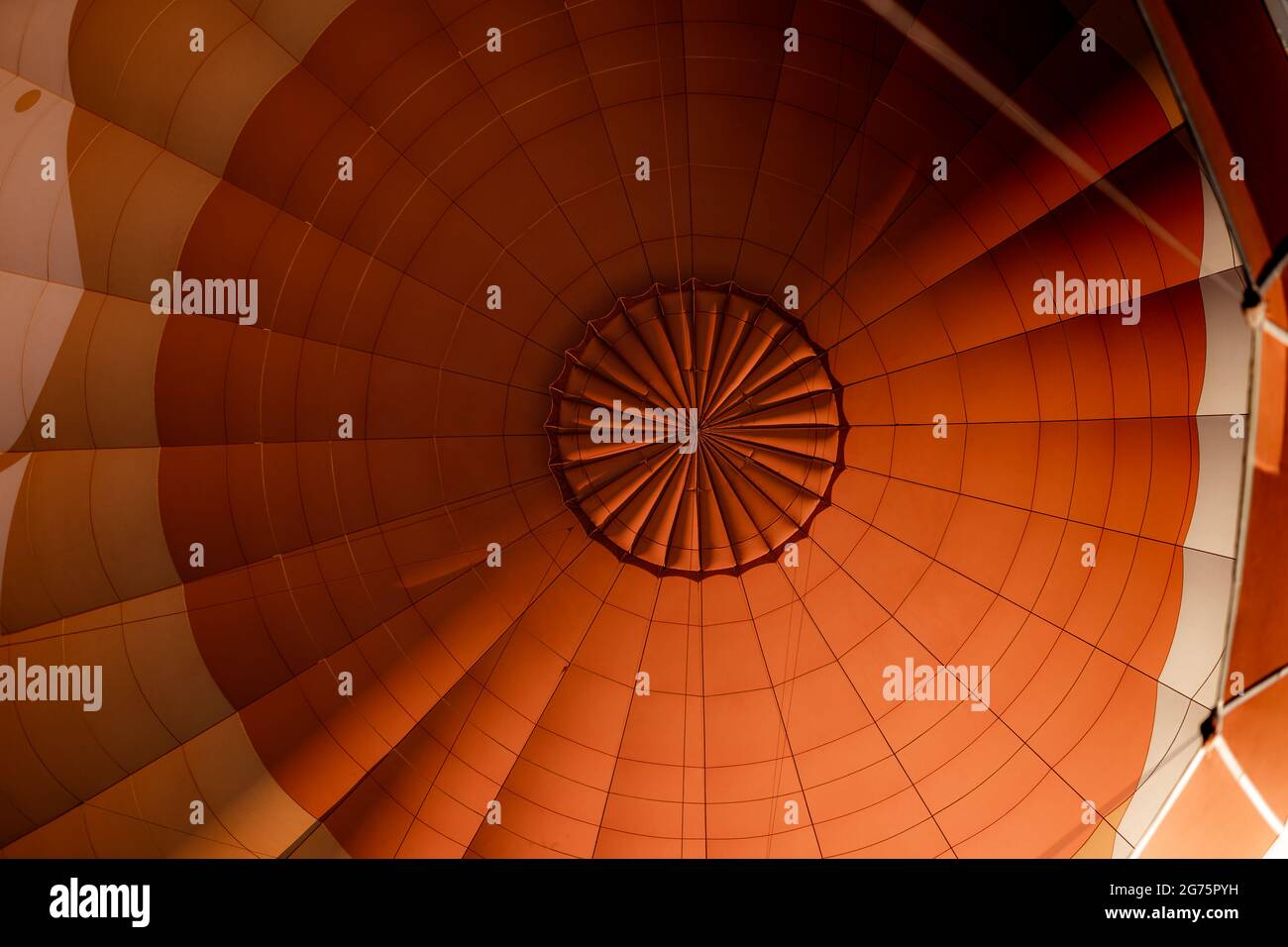 A low angle of the inner side of a vibrant orange air balloon- perfect ...
