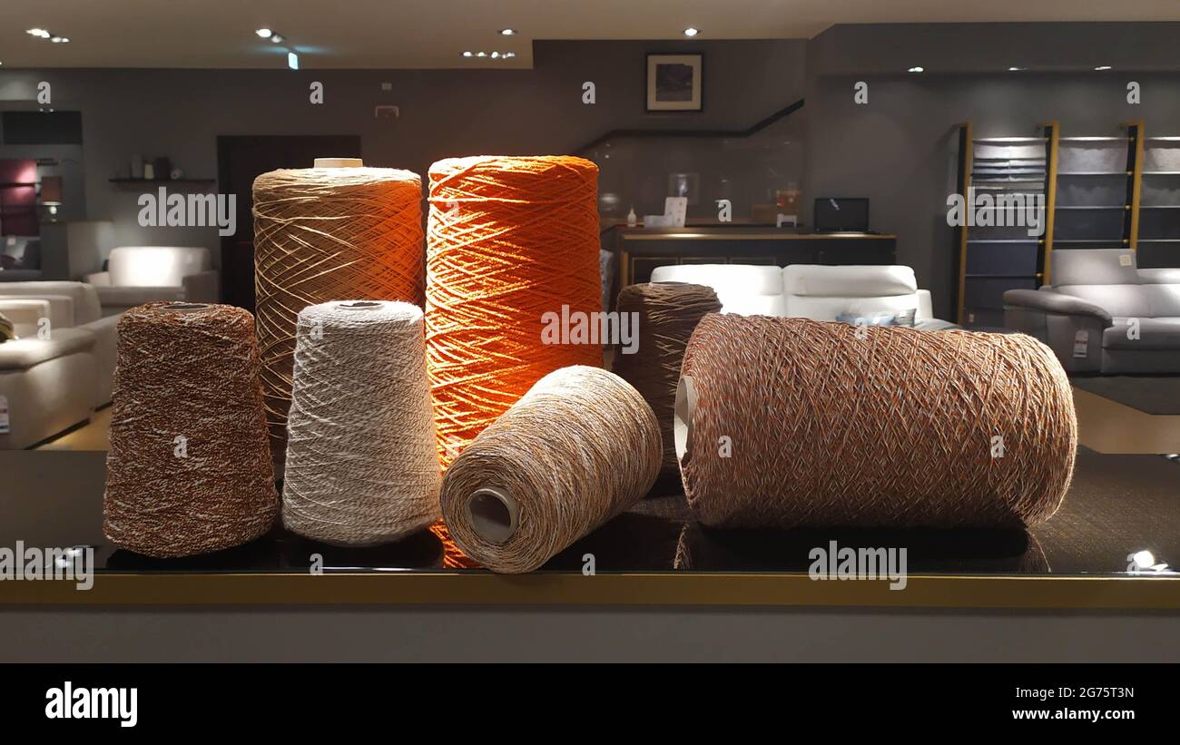Roll of wool fiber threads, colors analogous to orange Stock Photo - Alamy