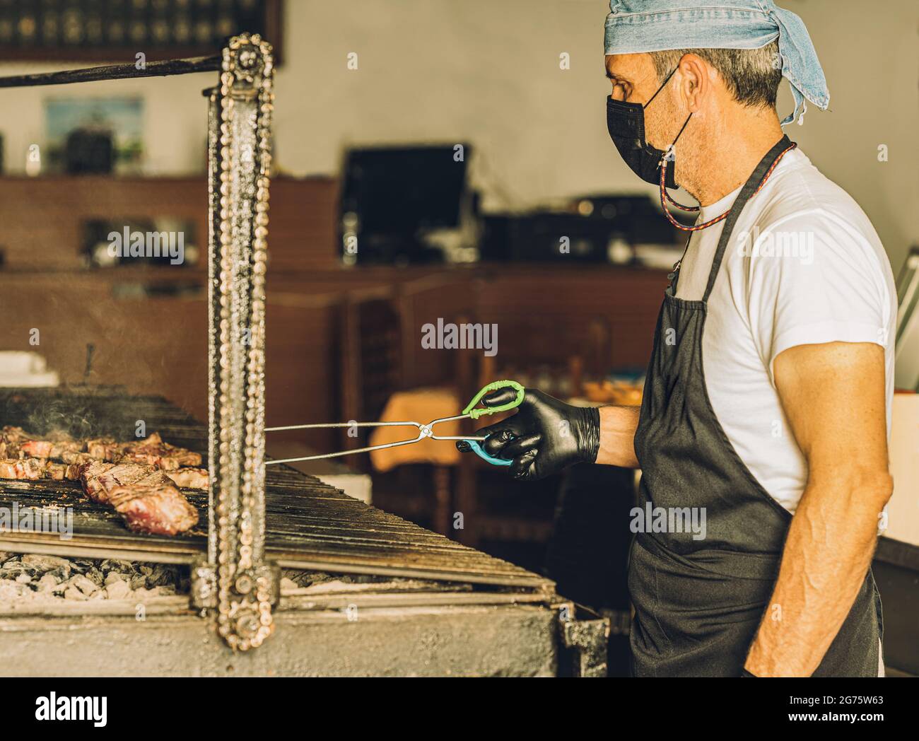 Chef in Face Mask Working Stock Photo - Alamy