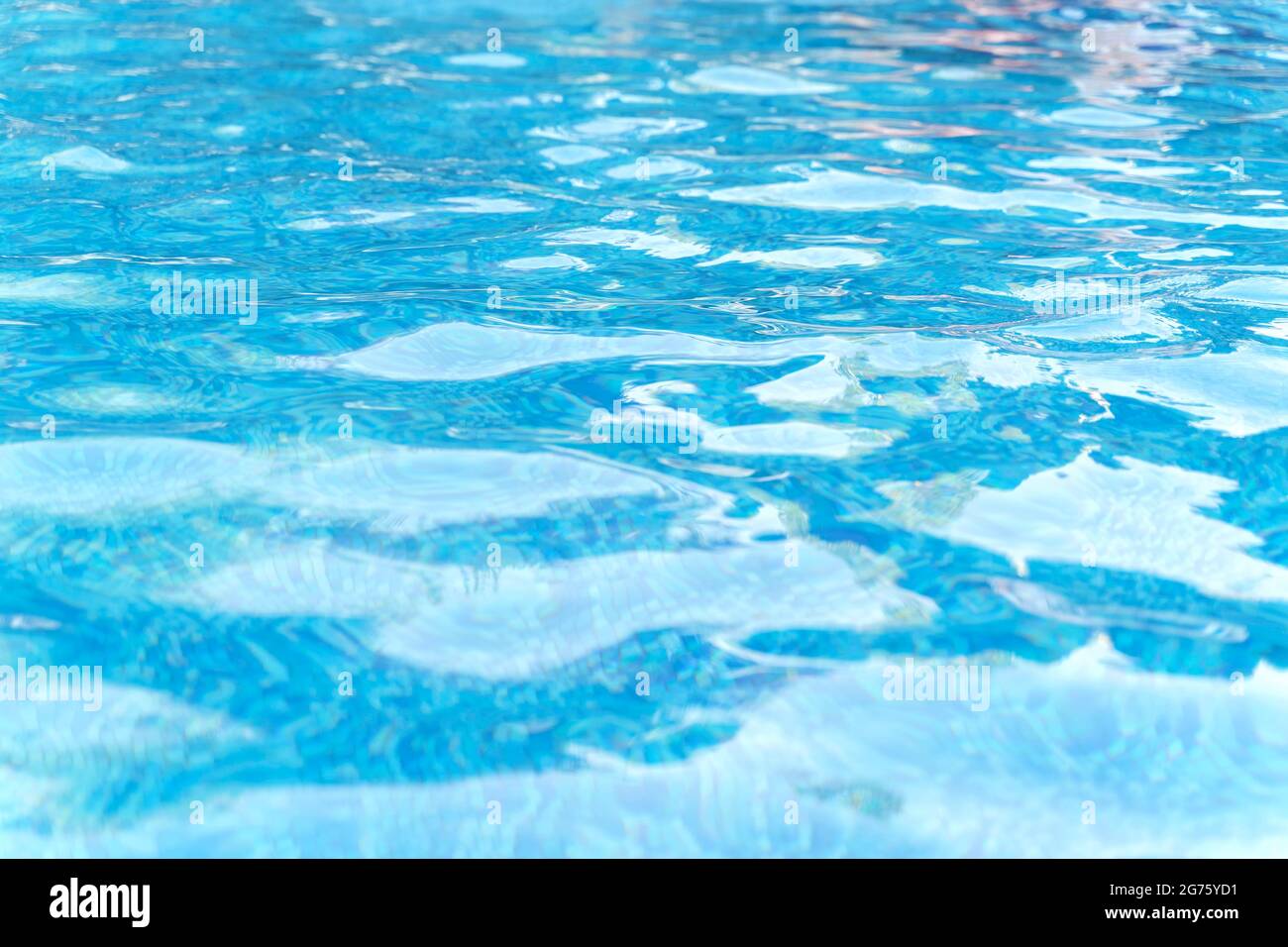 Swimming pool water ripple with solar reflection Stock Photo - Alamy