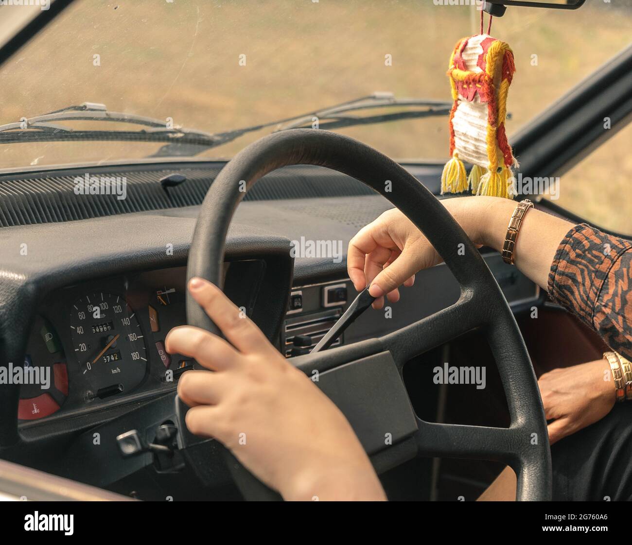 Woman driving antique car hi-res stock photography and images - Alamy