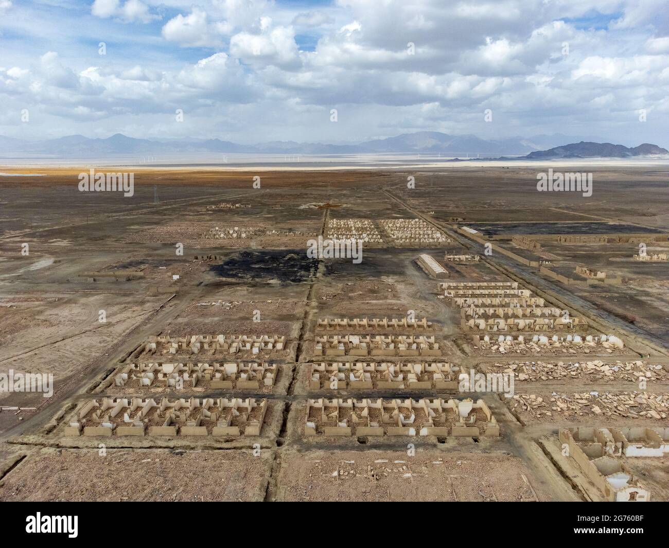 An aerial shot of the abandoned and destroyed oil base site in Lenghu ...