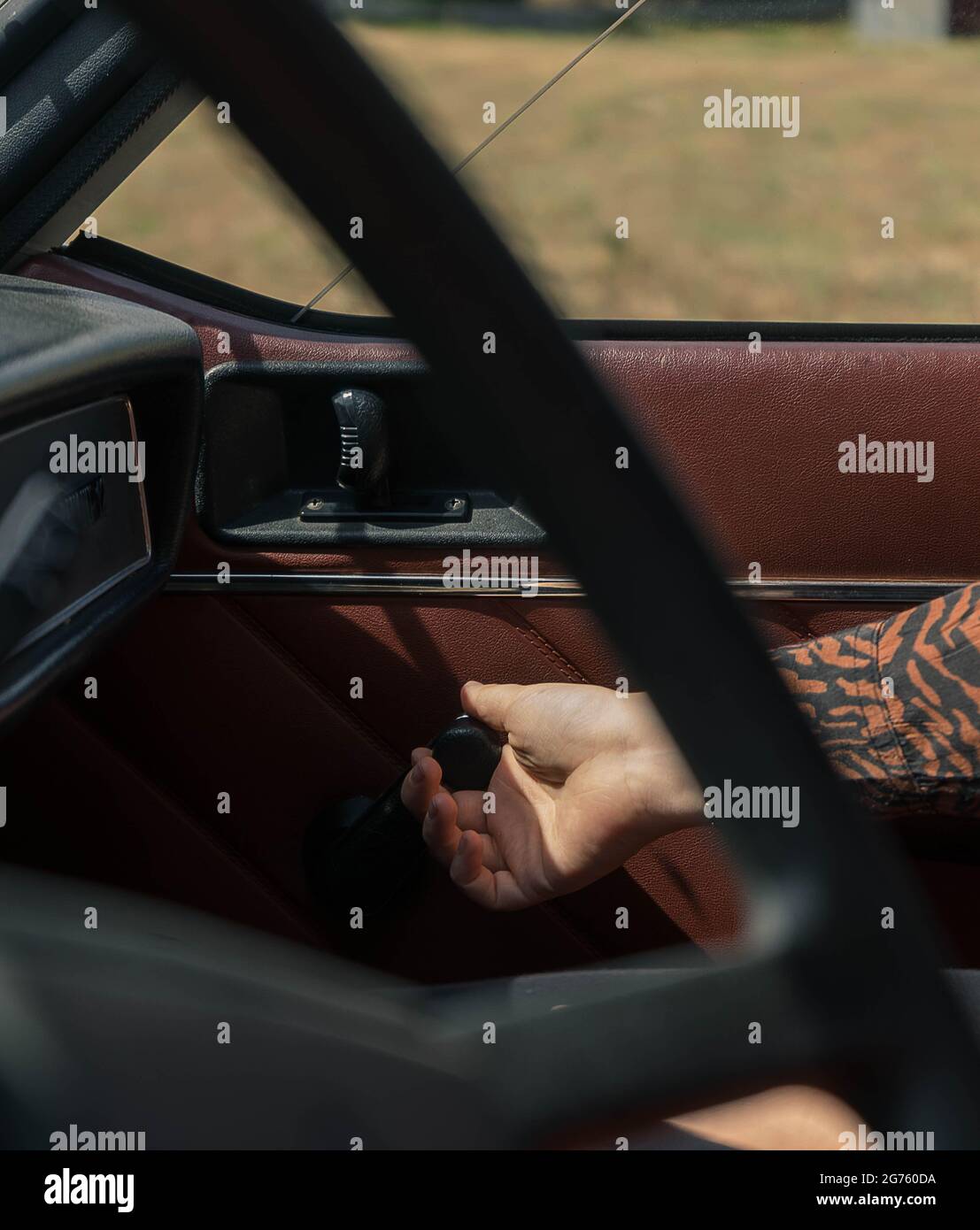 A female opening a car window Stock Photo - Alamy