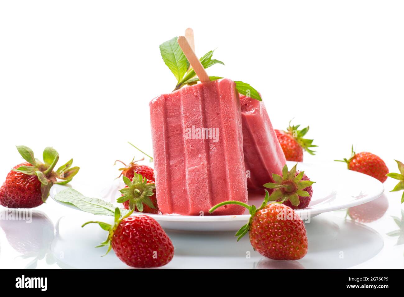 homemade strawberry ice cream on a stick made from fresh strawberries ...