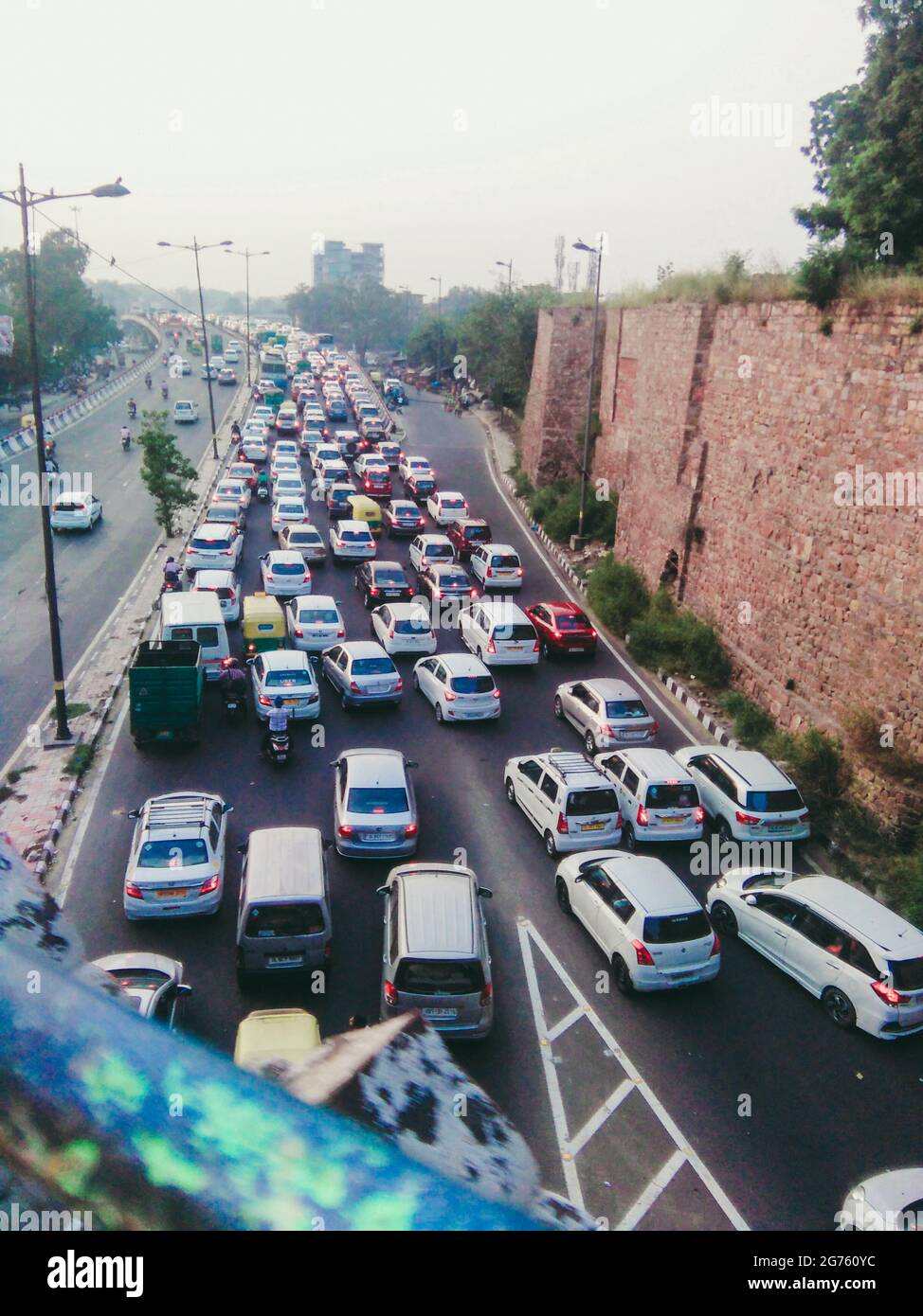An aerial view of traffic jam full of vehicle s in a narrow lane in a ...