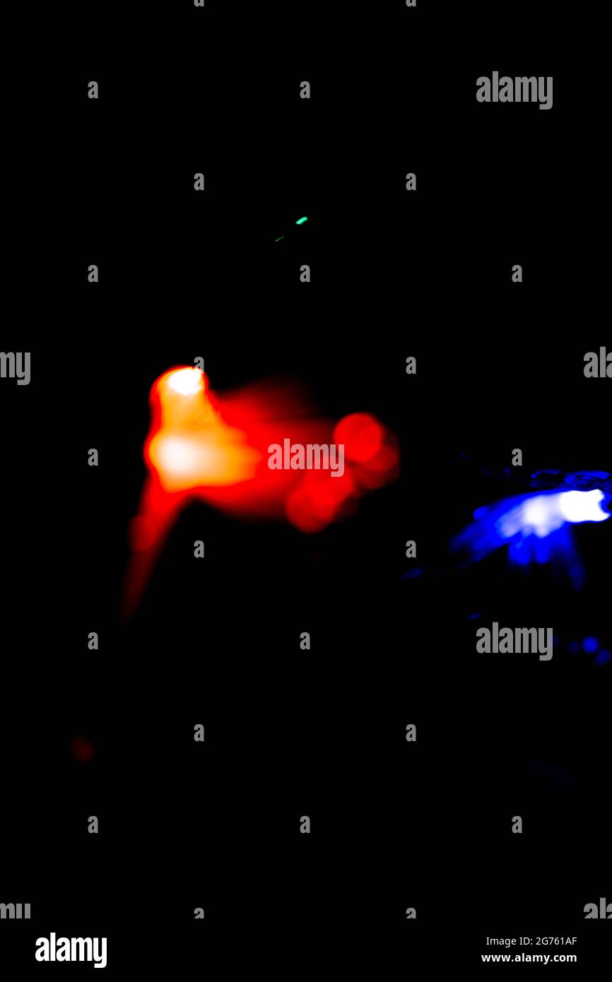 texture bokeh blue and red from the flashing lights of police cars and ...