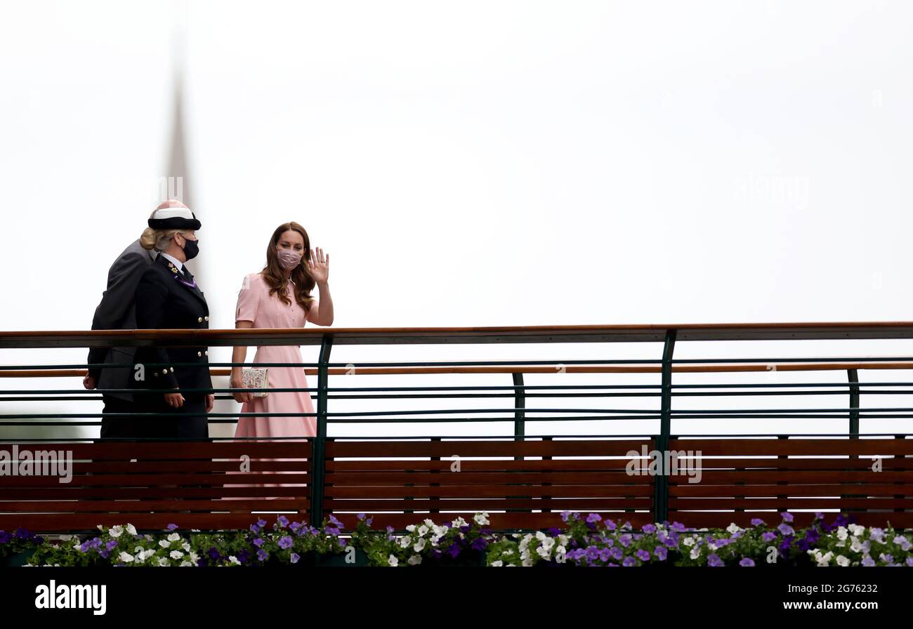 The Duchess of Cambridge walks across the player's bridge after ...