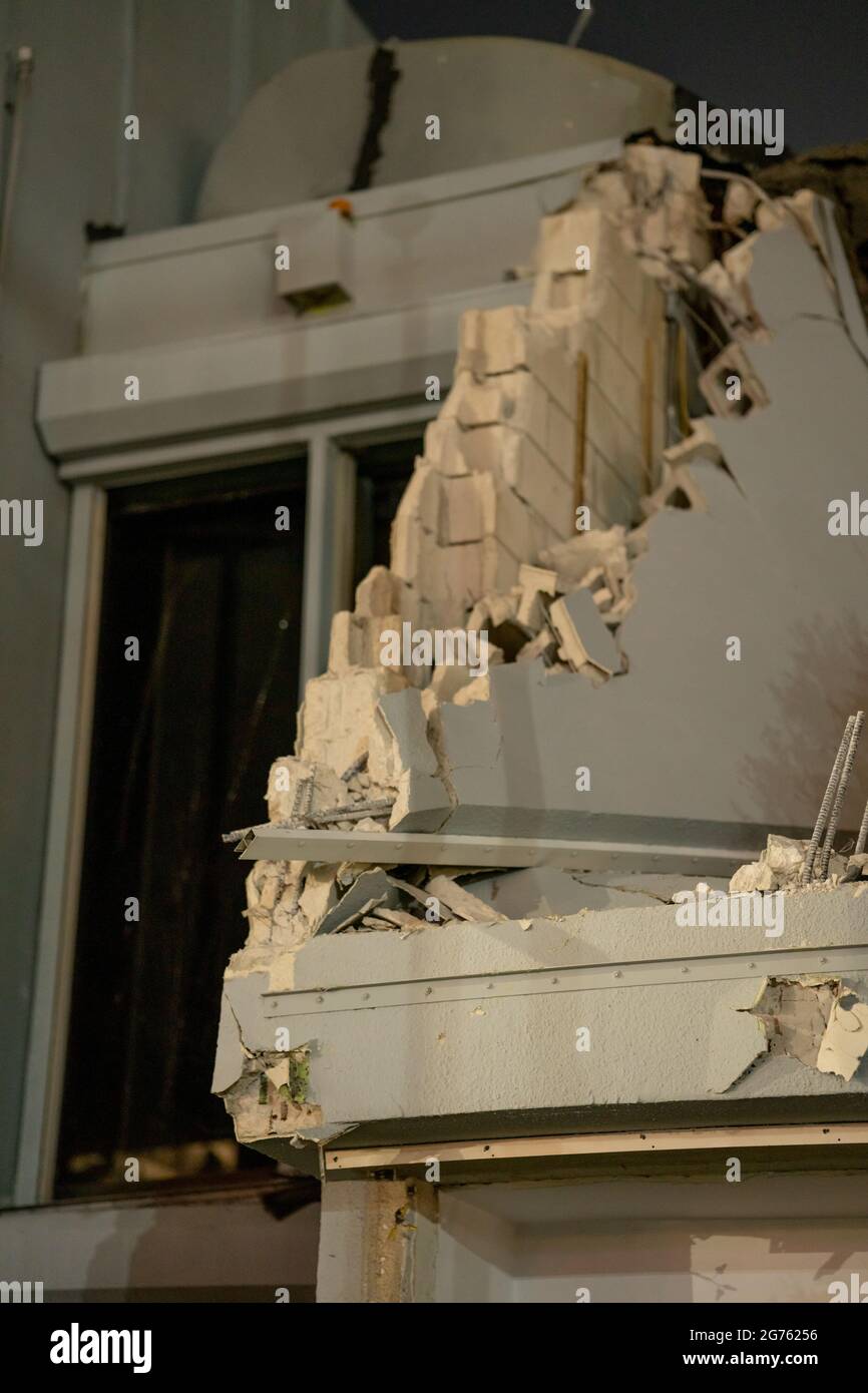 Buildings falling apart night photo Stock Photo - Alamy