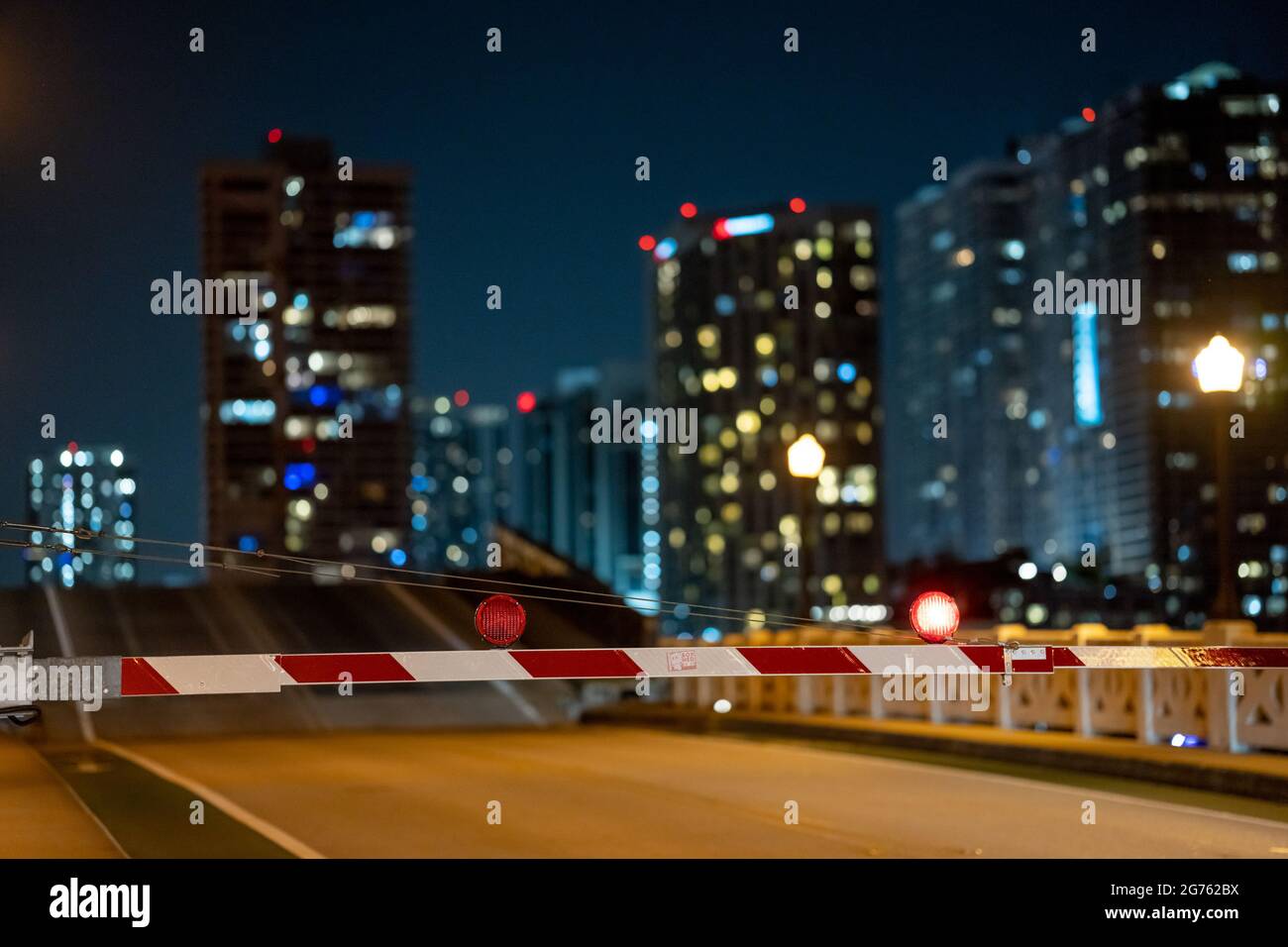 Photo of a drawbridge going up with city landscape buildings in ...