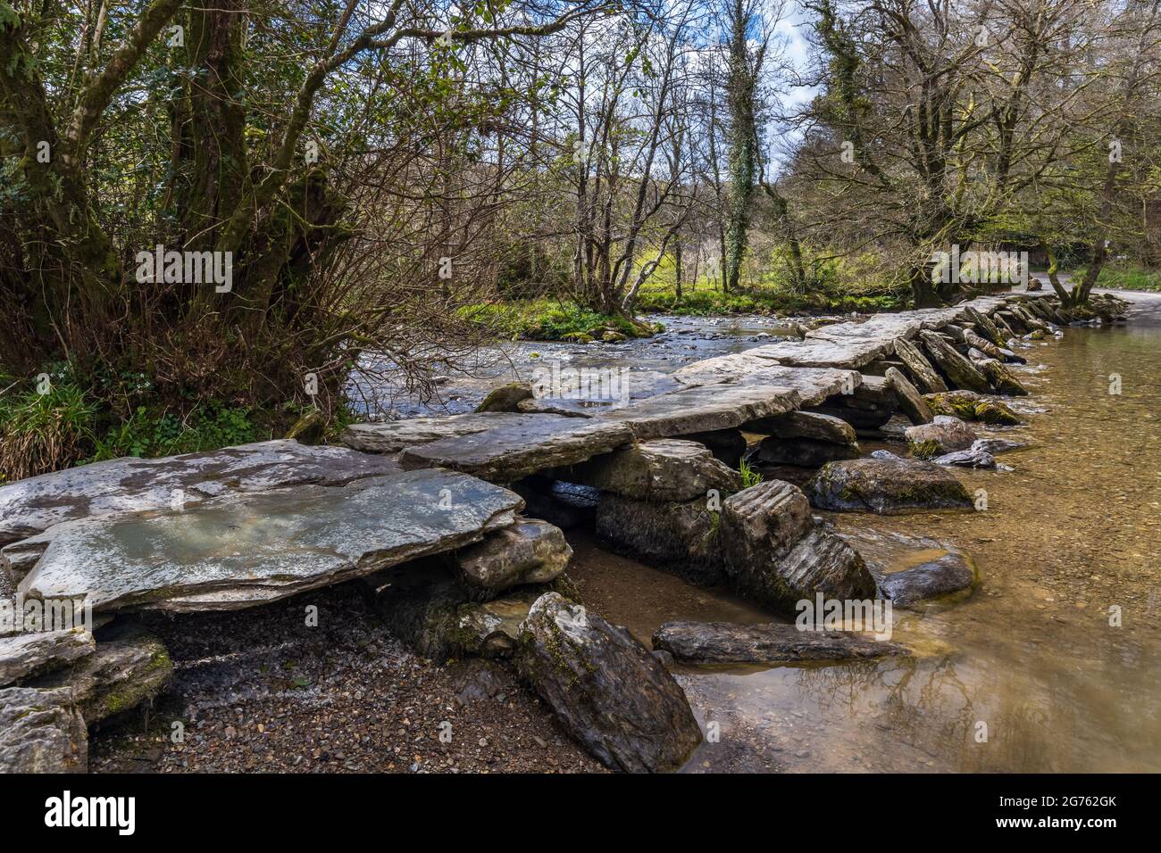 The Tarr Steps, a medieval clapper bridge over the River Barle in the ...