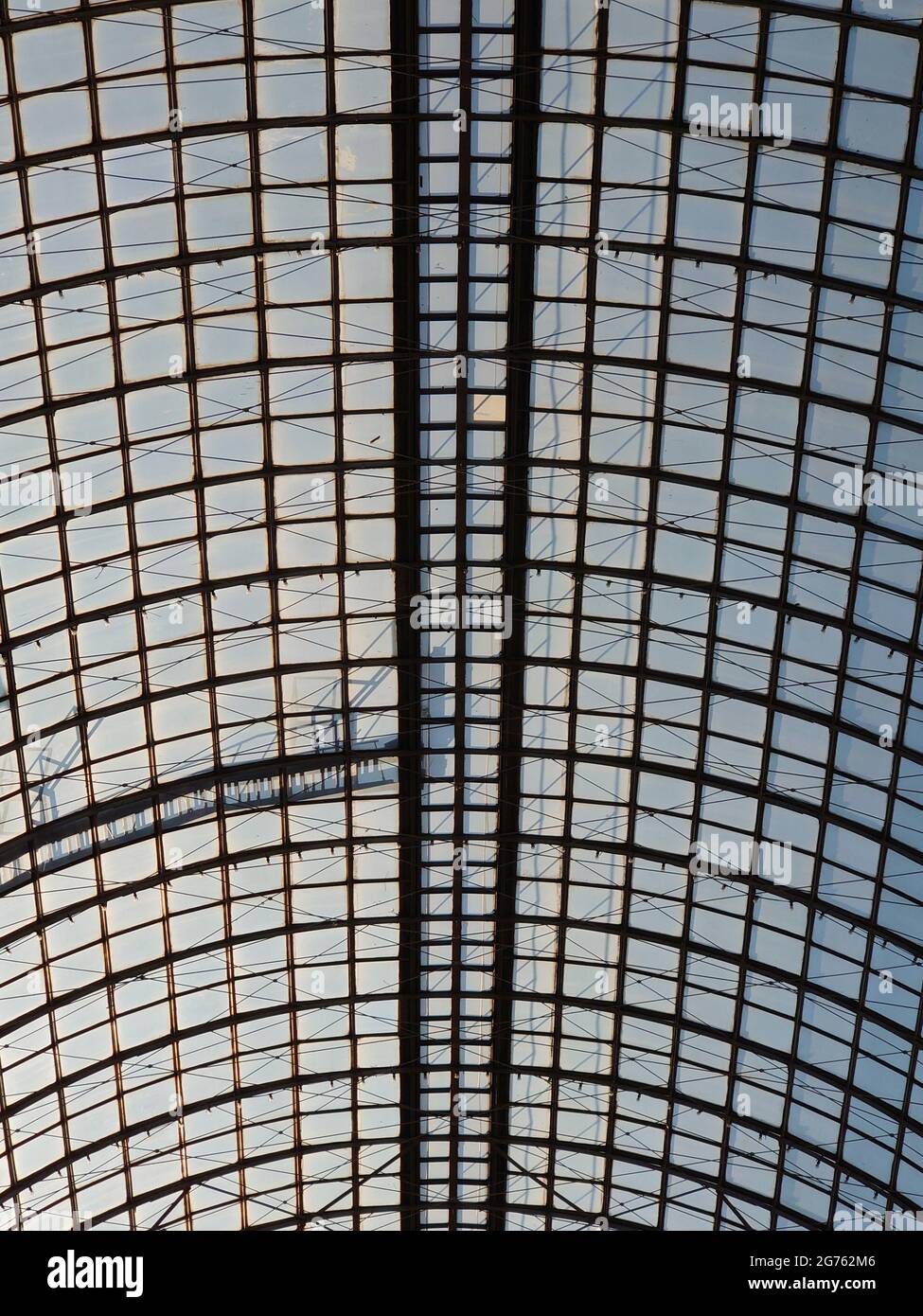 A bottom view of an arch glass modern ceiling Stock Photo - Alamy