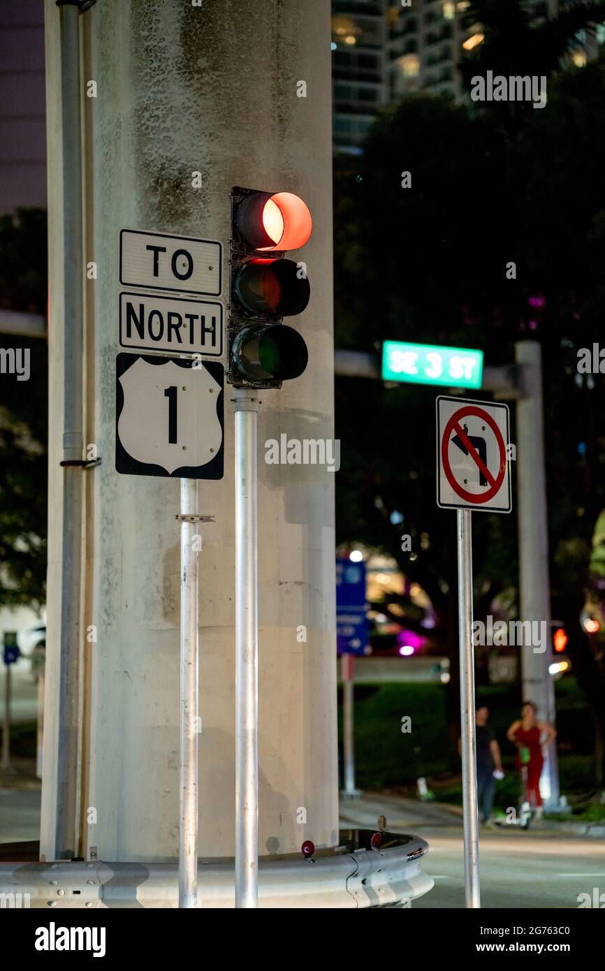 Street signs in the city at night Stock Photo - Alamy