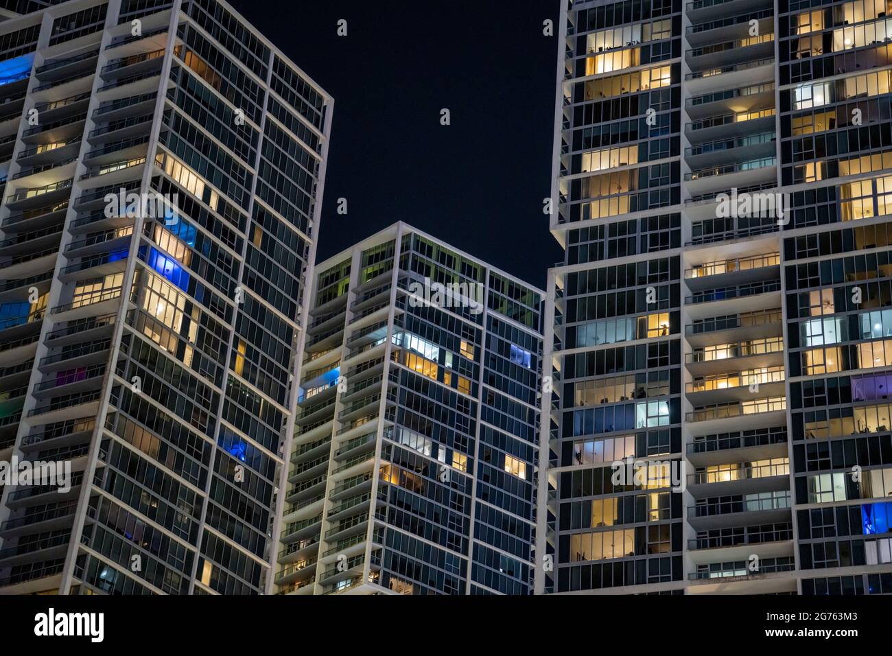 Highrise condos in the city lit at night Stock Photo - Alamy