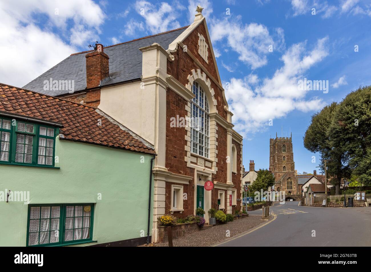 Chapel House in Dunster West Street, Somerset, with the Priory Church ...