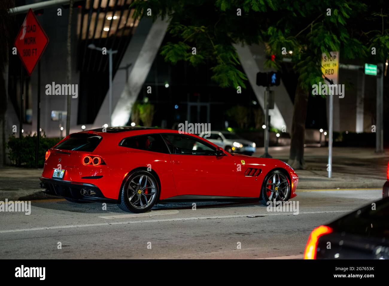 Miami, FL, USA - July 9, 2021: Red Ferrari out for a drive at night ...