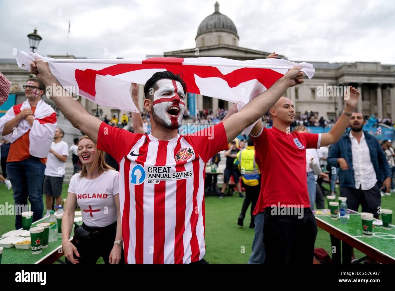 England fans sing the national anthem at the Trafalgar Square Fan Zone ...