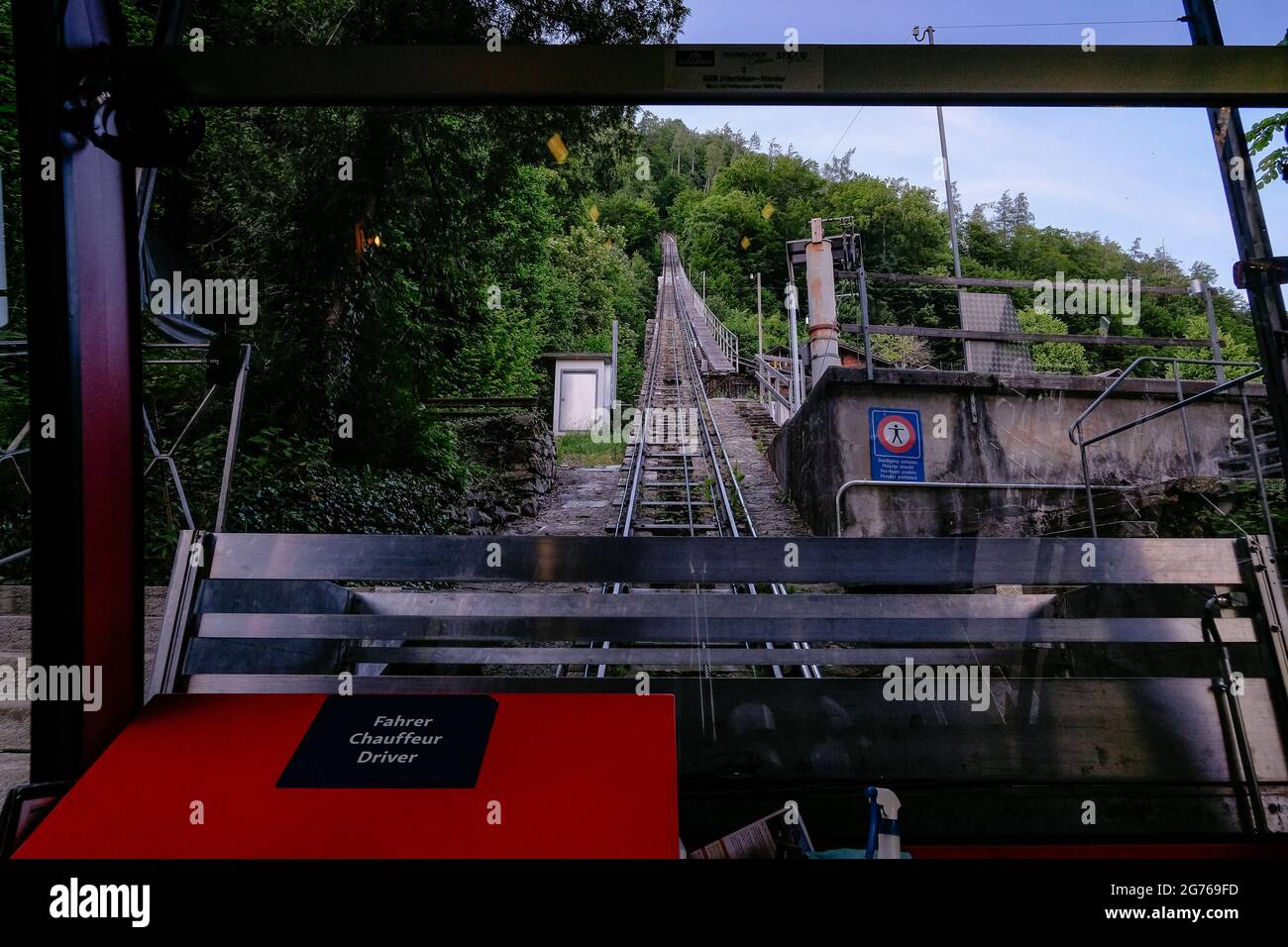 Red Funicular Train driving downhill from Harder Kulm, Top of ...