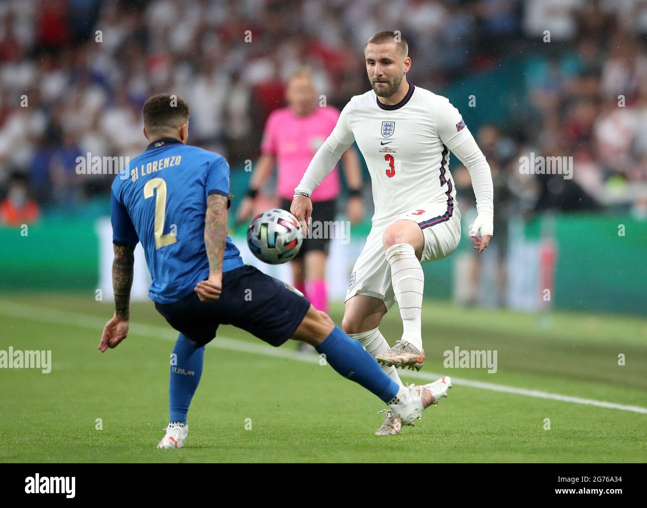 Italy's Giovanni Di Lorenzo (left) and England's Luke Shaw in action ...