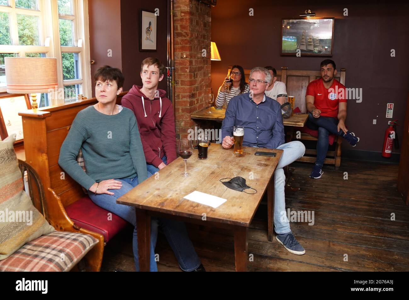 England fans at the Ye Olde Ship Inn in Guildford as they watch the ...