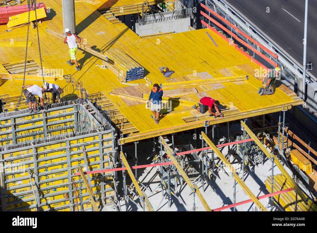 Wien, Vienna: construction site, setting up of the formwork, worker in ...