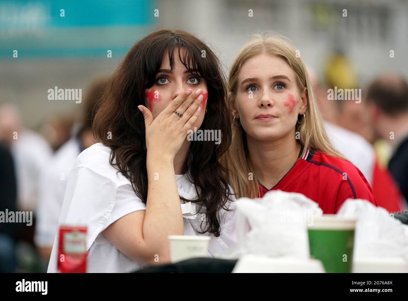 England fans look nervous at the Trafalgar Square Fan Zone in London as ...