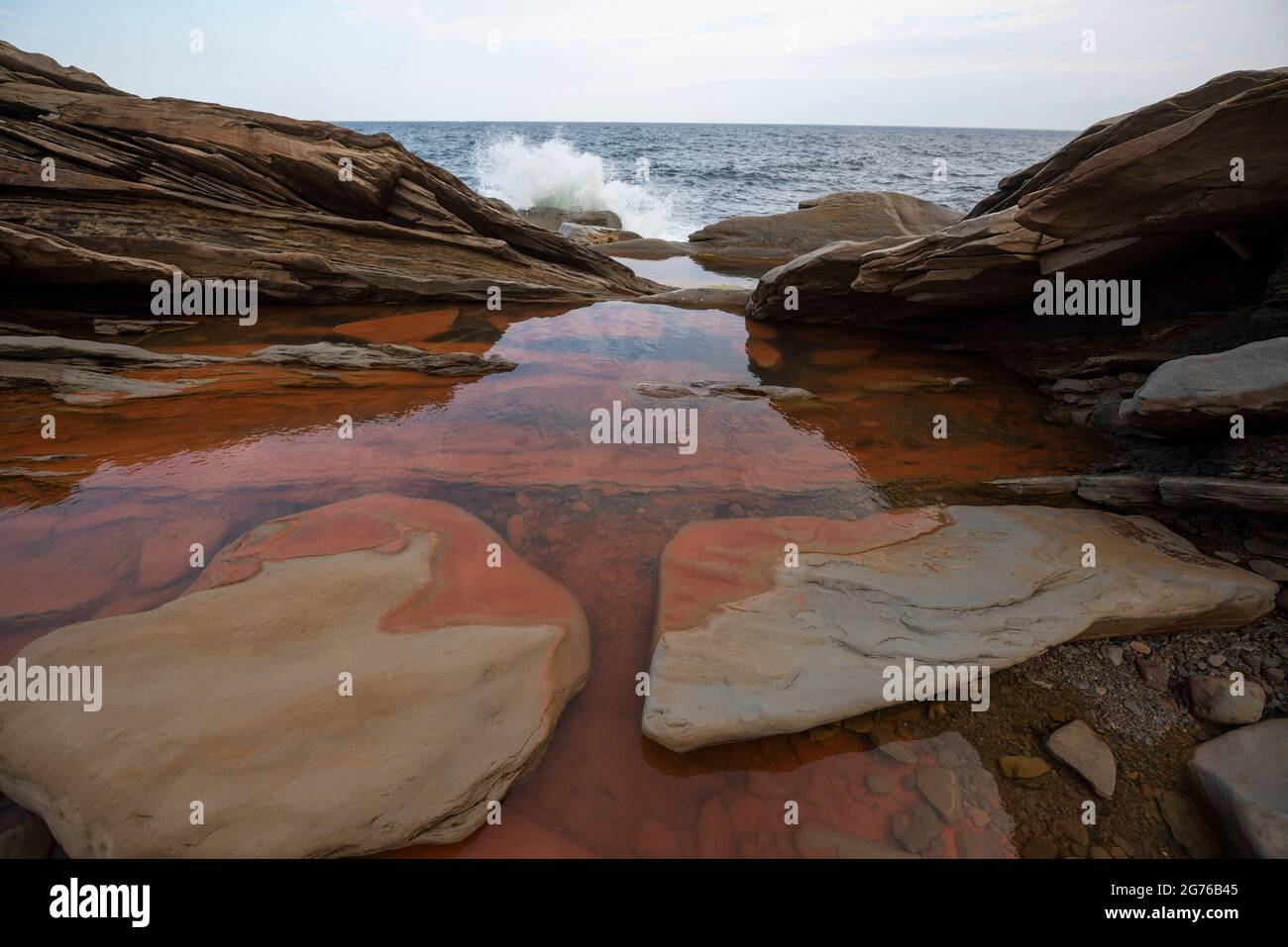 Rugged sedimentary rock along the shore of the St. Lawrence on Nova ...